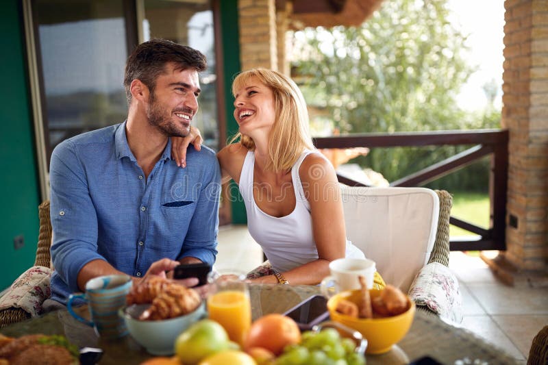 Man and Woman Having Fun during Breakfast Stock Photo - Image of ...