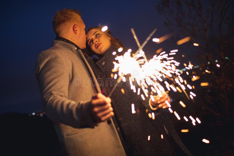 Man and Woman Holding a Burning Sparkler. Bengal Fire Stock Image ...
