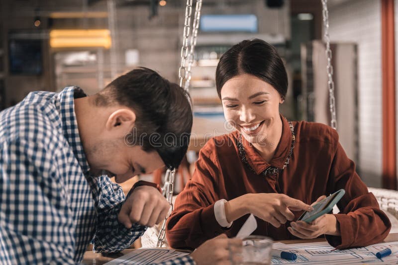 Man and Woman Laughing Discussing Presentation of Project Stock Photo ...