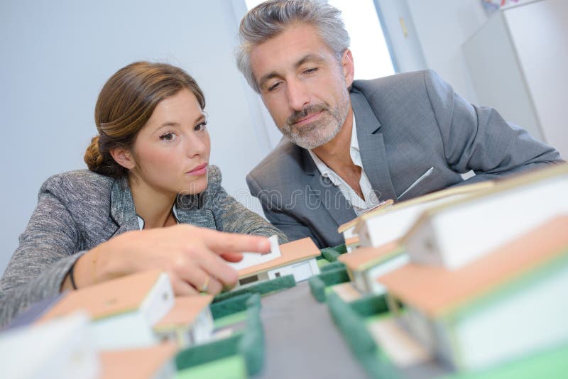 Man and Woman Looking at Model Housing Development Stock Image - Image ...
