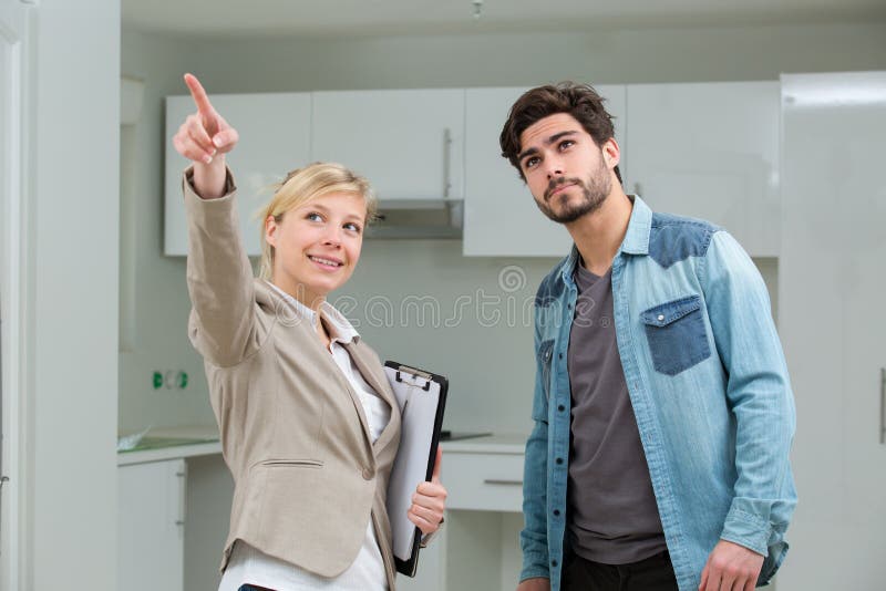 Man and Woman Looking and Pointing Up Stock Image - Image of pointing ...