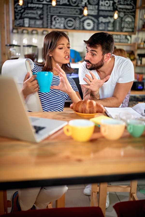 Man and woman making plans stock photo. Image of apron - 165369032