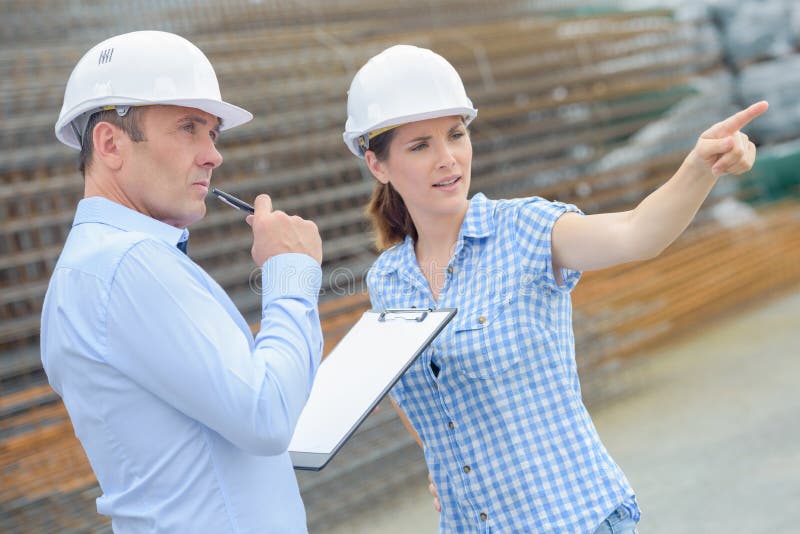 Man and Woman Meeting on Construction Site Stock Photo - Image of ...