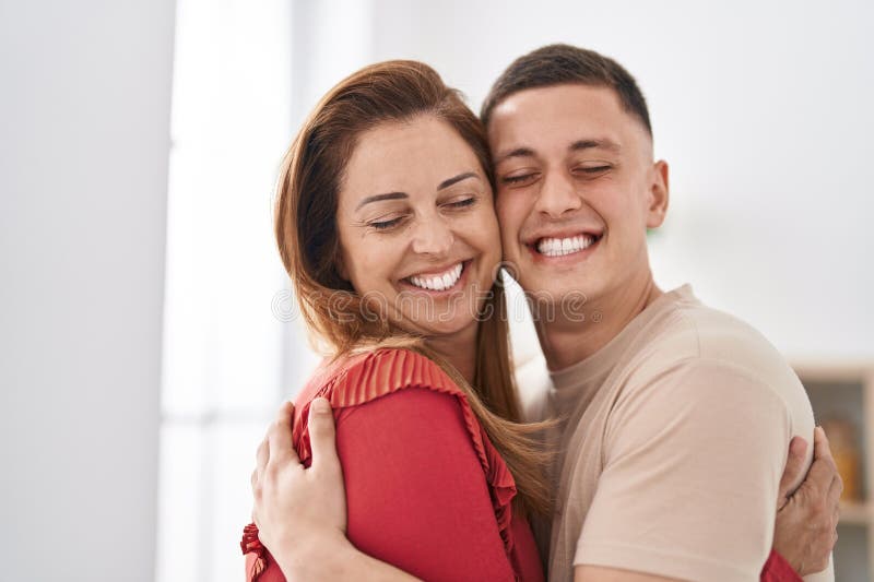 Man And Woman Mother And Son Hugging Each Other At Home Stock Image