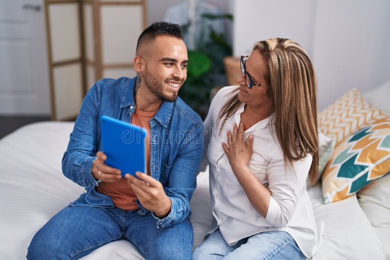 Man and Woman Mother and Son Using Touchpad at Bedroom Stock Photo ...