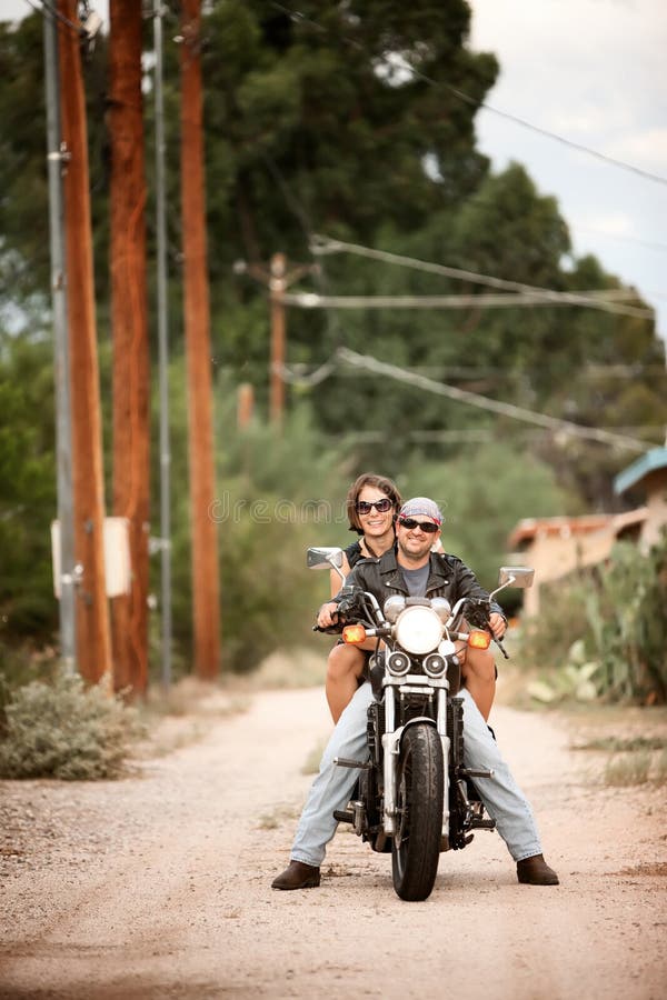 Man and Woman on Motorcycle Stock Photo - Image of smile, dirt: 11100438