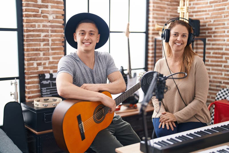 Man and Woman Musicians Playing Classical Guitar at Music Studio Stock ...