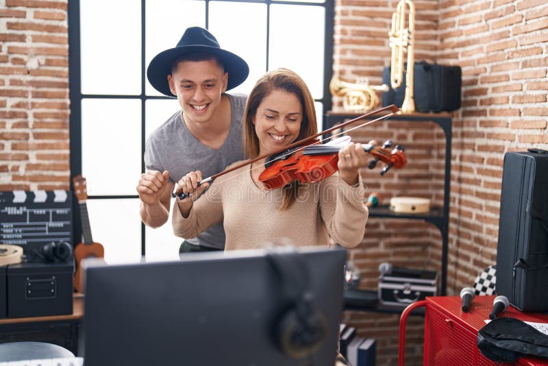 Man and Woman Musicians Playing Violin at Music Studio Stock Photo ...