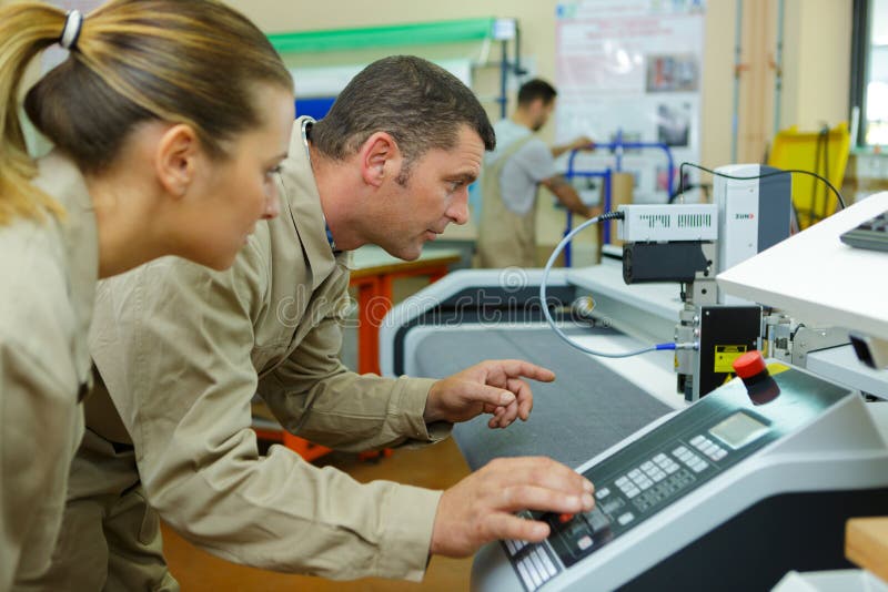 Woman Operating Drilling Machine Concentrating on Job Stock Photo ...