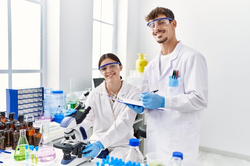 Man and Woman Partners Wearing Scientist Uniform Working at Laboratory ...