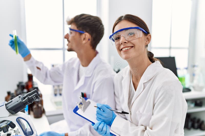 Man and Woman Partners Wearing Scientist Uniform Working at Laboratory ...