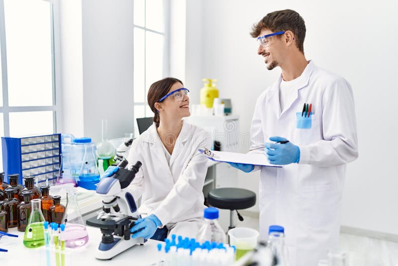 Man and Woman Partners Wearing Scientist Uniform Working at Laboratory ...