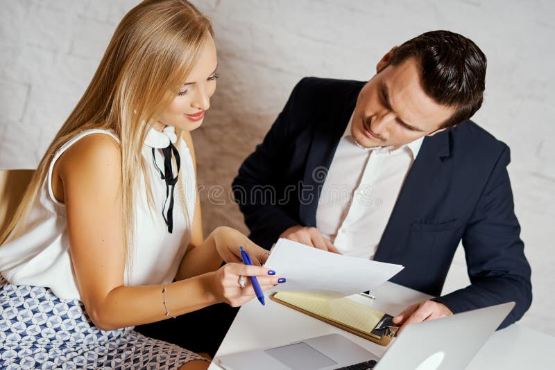 Man and Woman are Reviewing Documents in the Office Stock Image - Image ...