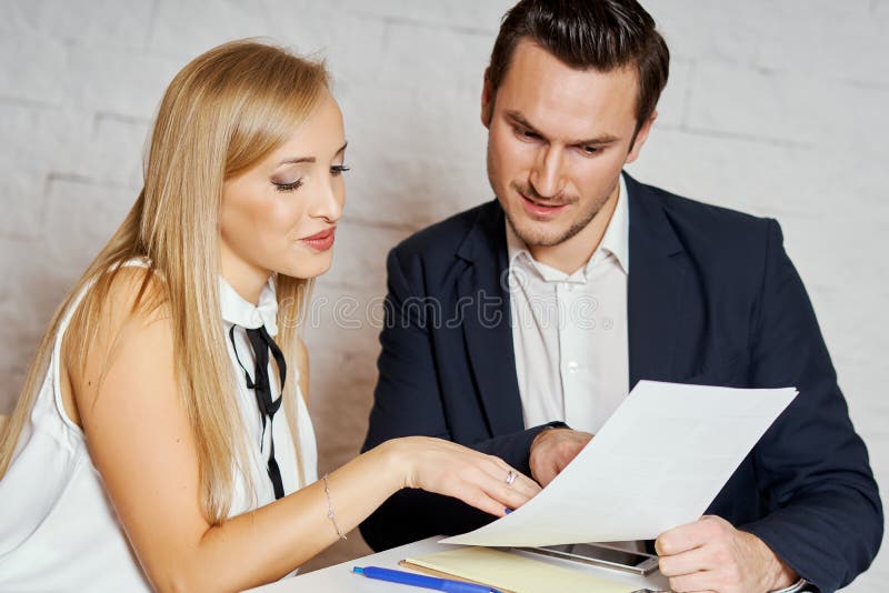 Man and Woman are Reviewing Documents in the Office Stock Image - Image ...