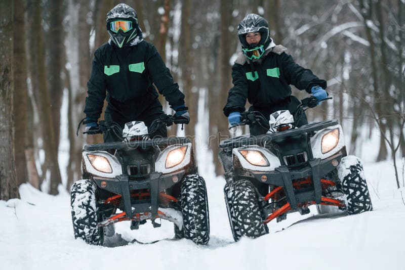Man and Woman are Riding ATV in the Winter Forest Stock Photo - Image ...