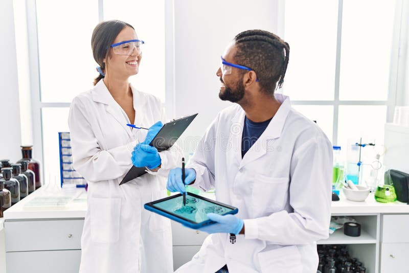 Man and Woman Scientist Partners Looking Embryo Image on Touchpad at ...