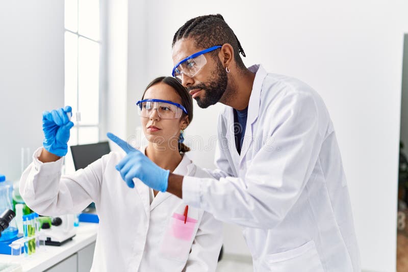 Man and Woman Scientist Partners Looking Sample Working at Laboratory ...