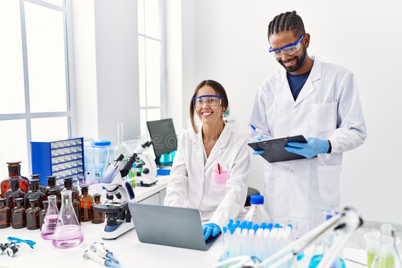 Man and Woman Scientist Partners Smiling Confident Working at ...