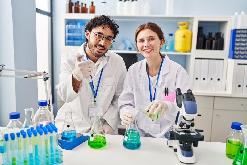 Man and Woman Scientist Partners Smiling Confident Working at ...