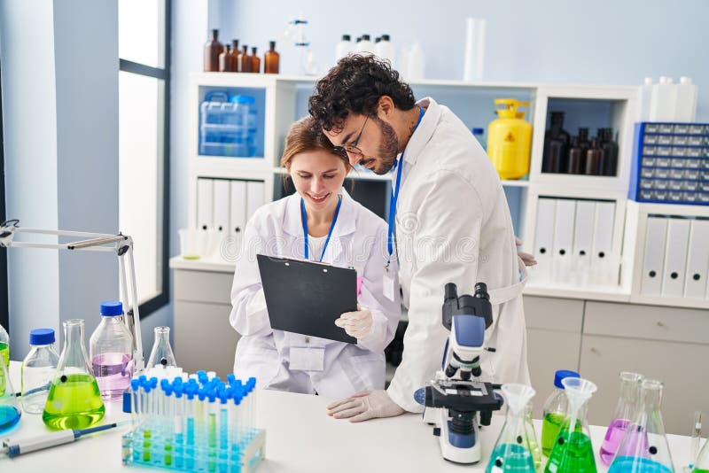 Man and Woman Scientist Partners Working at Laboratory Stock Image ...