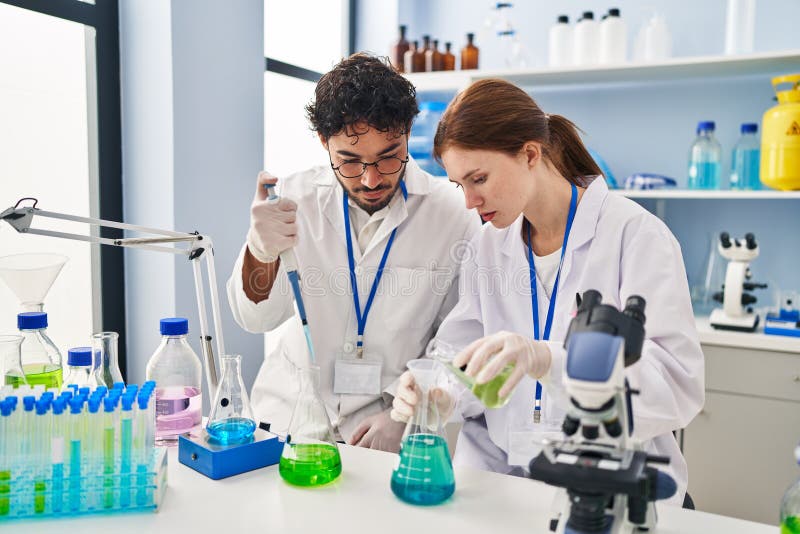 Man and Woman Scientist Partners Working at Laboratory Stock Photo ...