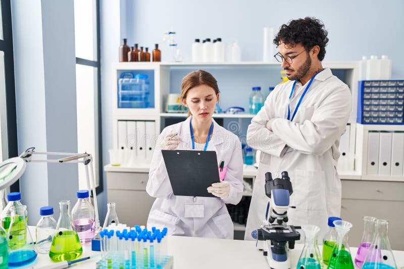Man and Woman Scientist Partners Working at Laboratory Stock Photo ...