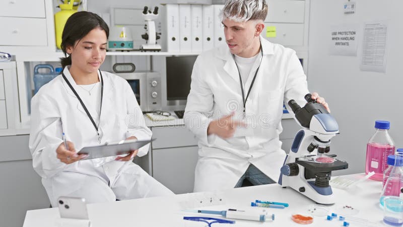 Two Scientists are Collaborating on Laboratory Research Studying Blue ...