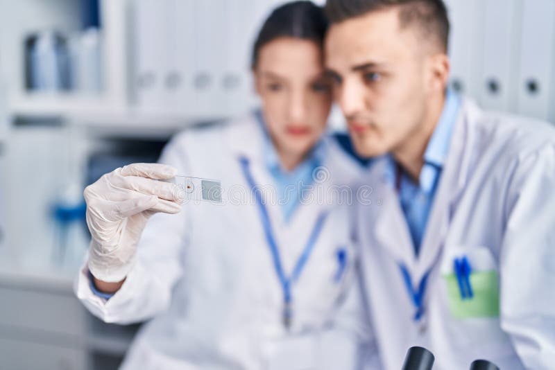 Man and Woman Scientists Looking Sample at Laboratory Stock Image ...