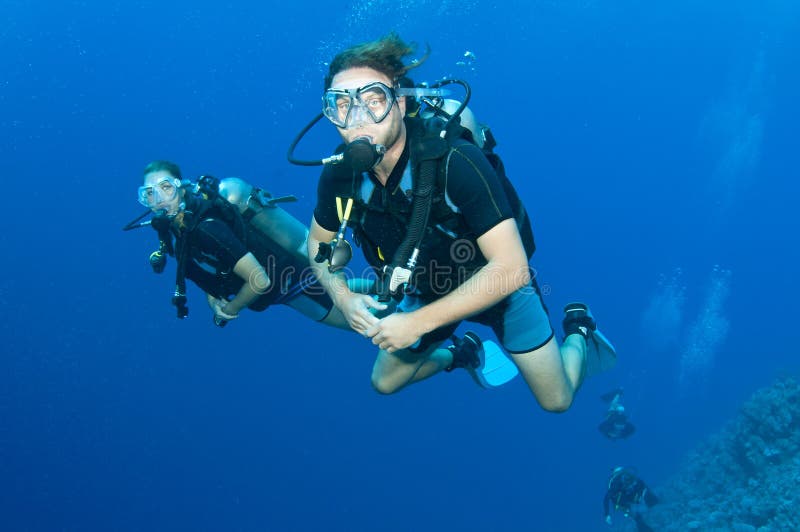 Man and Woman Scuba Dive Togeather Stock Image - Image of bubbles, fins ...