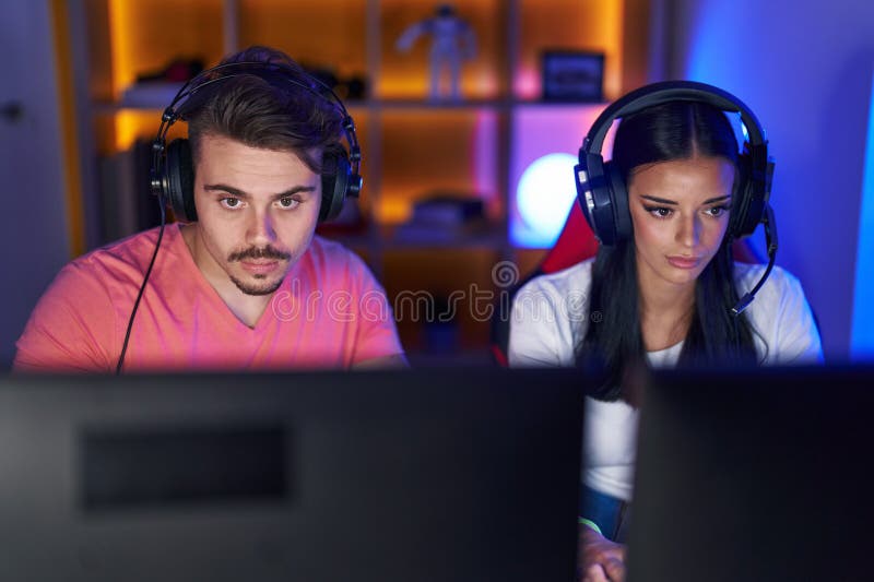 Man and Woman Streamers Playing Video Game Using Computer at Gaming ...
