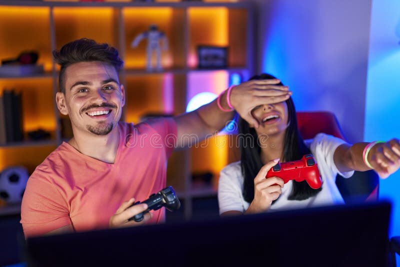 Man and Woman Streamers Playing Video Game Using Computer and Joystick ...