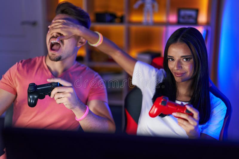 Man and Woman Streamers Playing Video Game Using Computer and Joystick ...