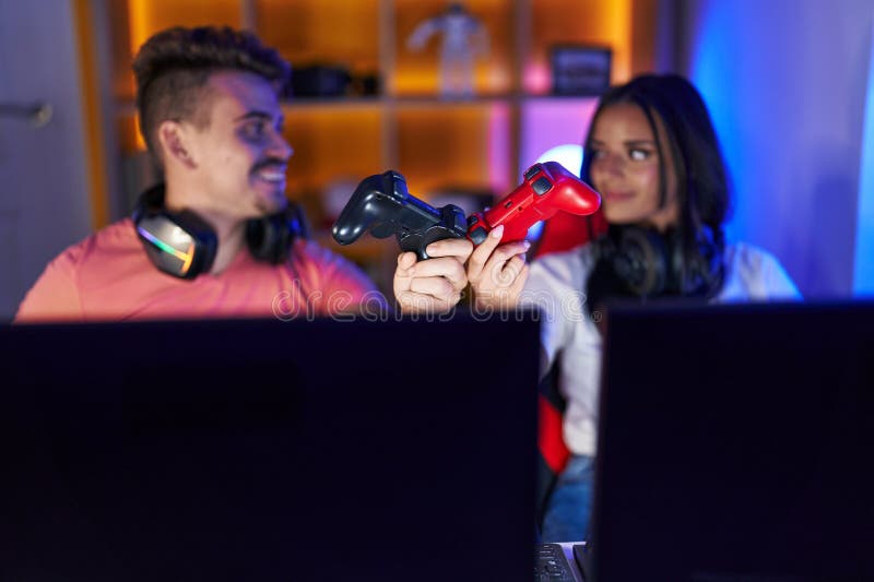 Man and Woman Streamers Playing Video Game Using Computer and Joystick ...
