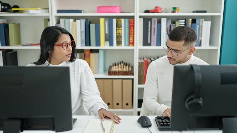 Man and Woman Students Using Computer Studying at University Classroom ...