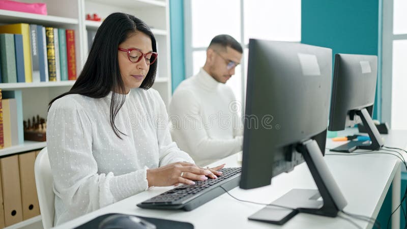 Man and Woman Students Using Computer Studying at University Classroom ...