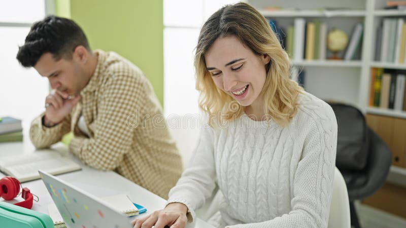 Man and Woman Students Using Laptop Writing Notes at Library University ...