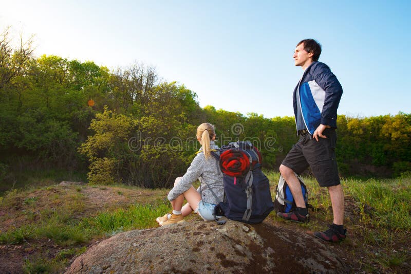 Man And Woman Traveler Outdoors Couple Of Hikers With Backpacks Stock