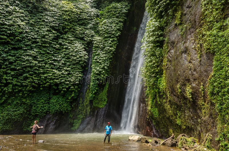 Man and Woman at Waterfall in Indonesia Editorial Photography - Image ...