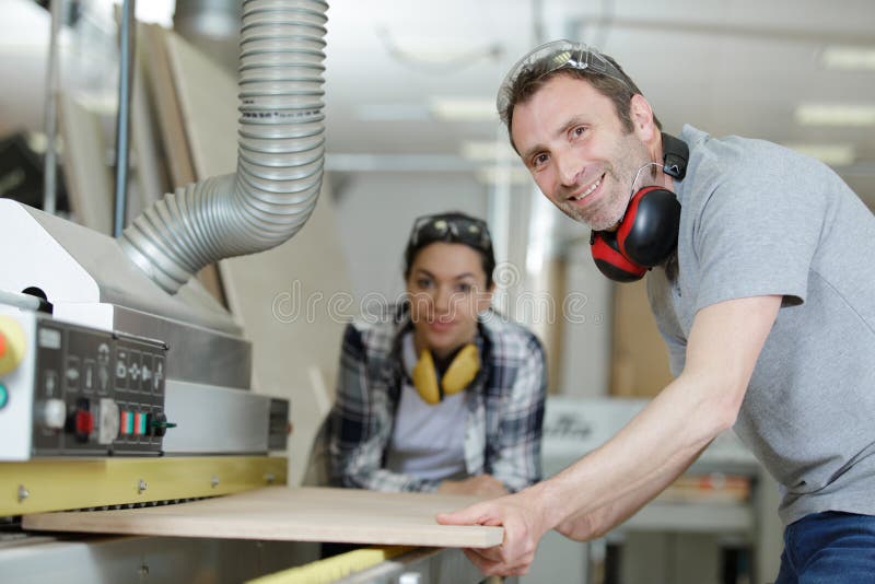 Man and Woman Workers in Carpentry Workshop Stock Photo - Image of ...
