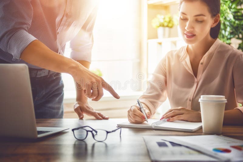 Man and Woman Working in the Office Stock Image - Image of paper ...