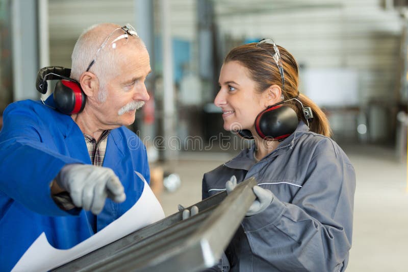 Man and Woman Working Together in Factory Stock Image - Image of ...