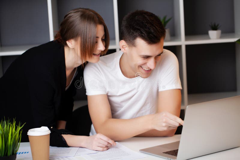 Man and Woman Working Together on a Project in the Office Stock Image ...