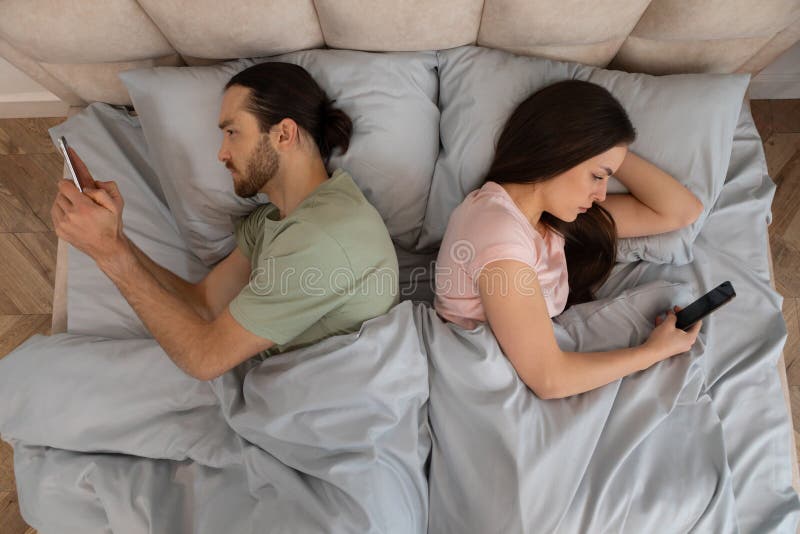 Couple in Bed on Phones, Lying Back To Back Stock Photo - Image of home ... Couple in Bed on Phones, Lying Back To Back Stock Photo - Image of home ...