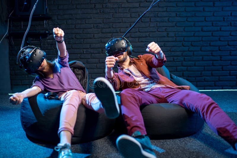 Man and Woman Playing Virtual Reality Together in the Club Stock Image ... Man and Woman Playing Virtual Reality Together in the Club Stock Image ...