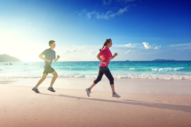 Man and Women Running on Tropical Beach Stock Image - Image of healthy ...