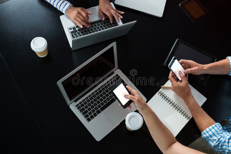 Man and Women Using Mobile Phone and Laptop Stock Photo - Image of ...