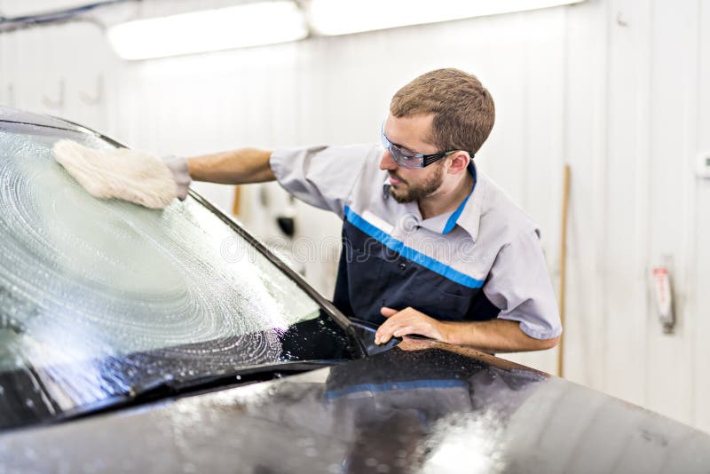 Man at Work Cleaning Automobile at Car Wash Stock Photo - Image of ...