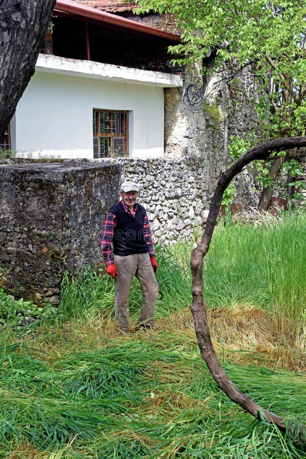 Man Dressed in Work Clothes, Standing in Front of Airport Entrance ...