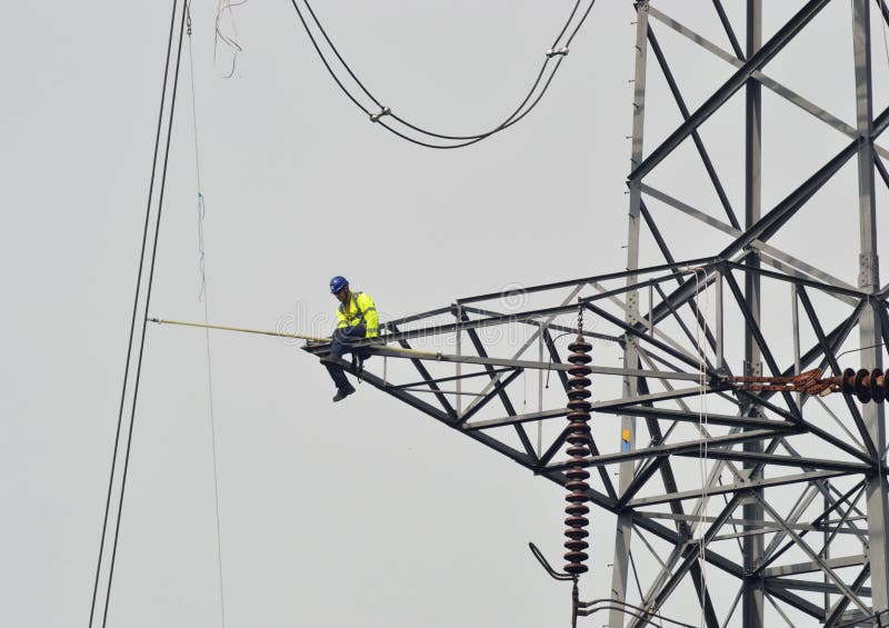 Man at Work on Electricity Pylon Editorial Photography - Image of ...
