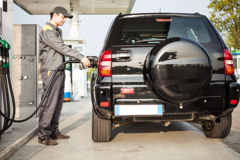 Man at Work at a Gas Station Stock Photo - Image of station, engine ...